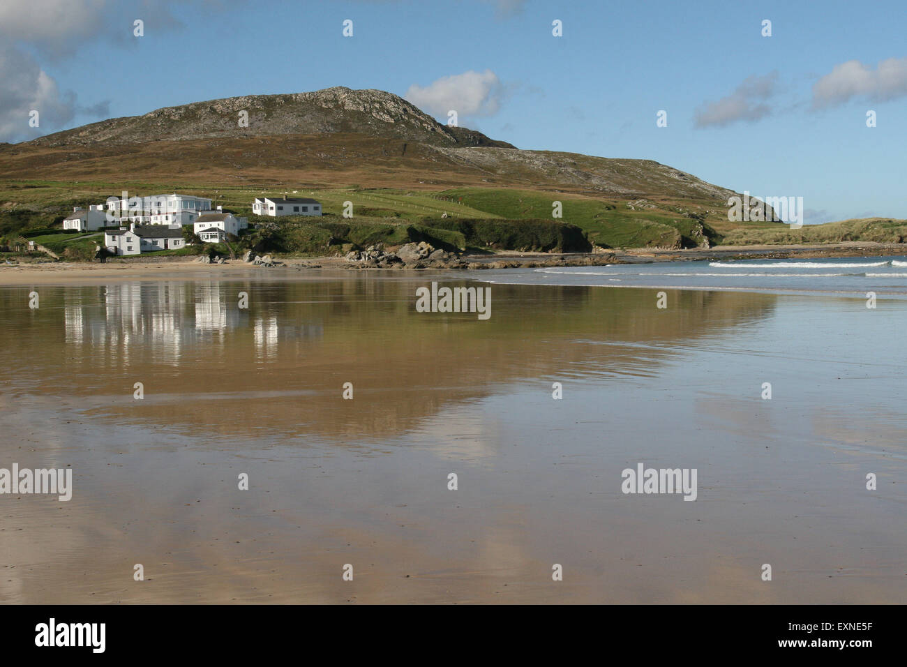Sandy beach with seaside cottages at Pollan Bay near Ballyliffin ...