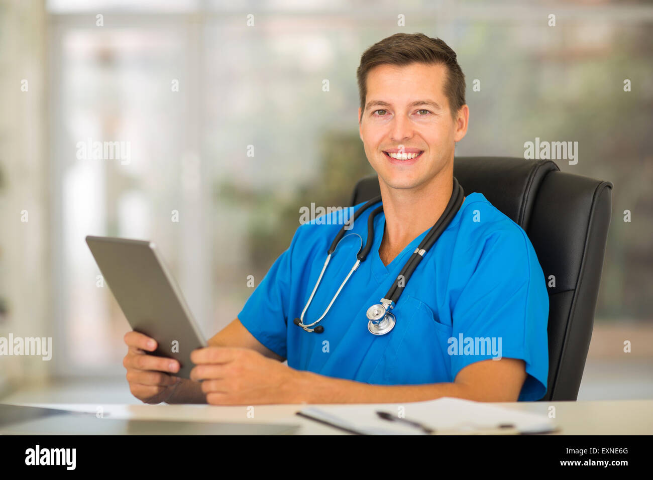 portrait of happy medical professional in office Stock Photo - Alamy
