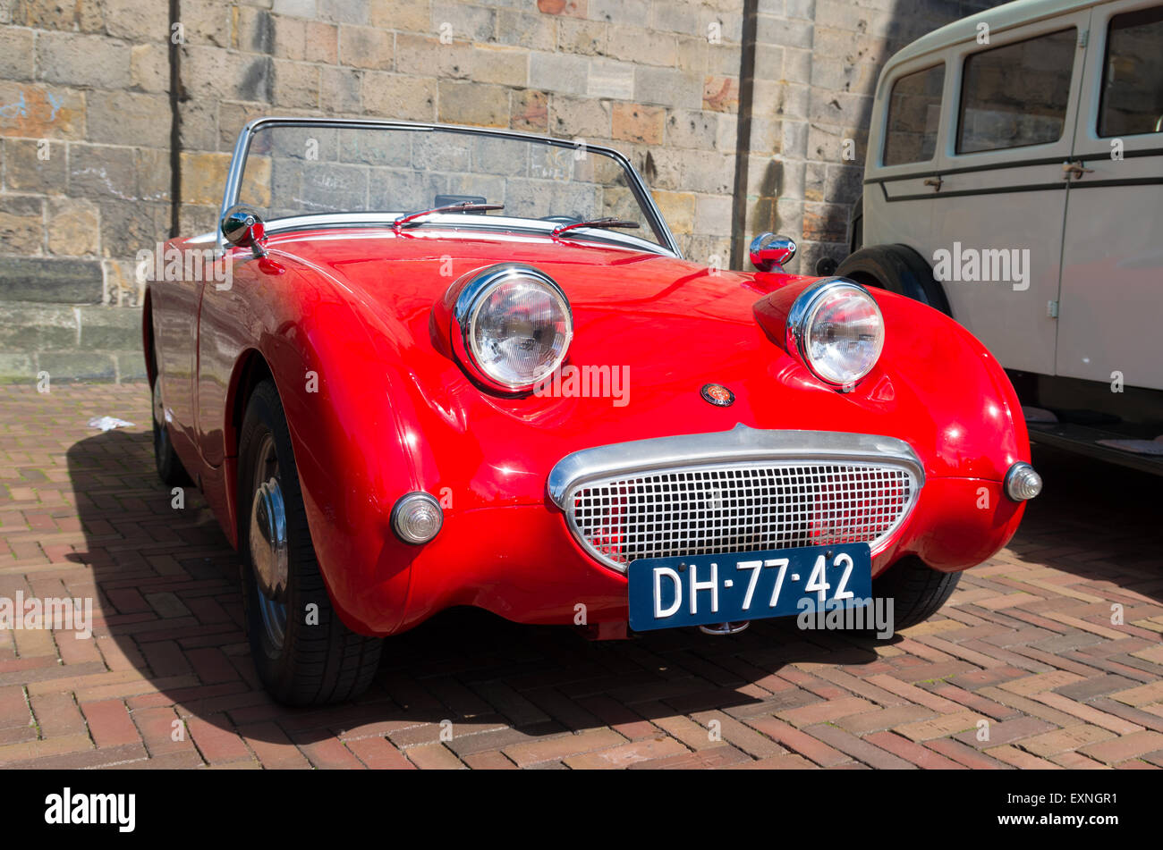 vintage red oldtimer car during the 14th orange tour. This annual tour ...