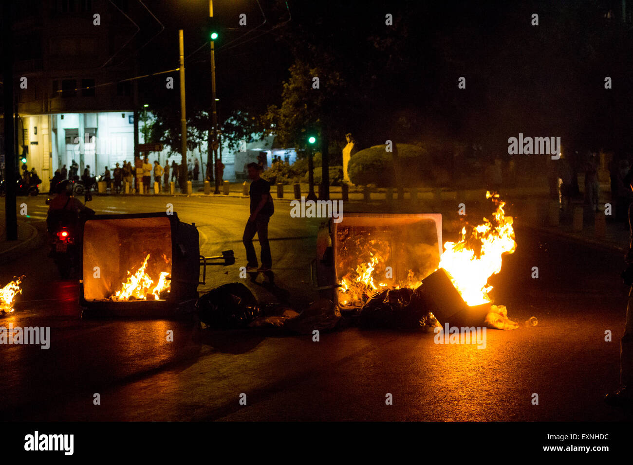 Athens, Greece. 15th July, 2015. Dumpsters are set on fire by rioters ...