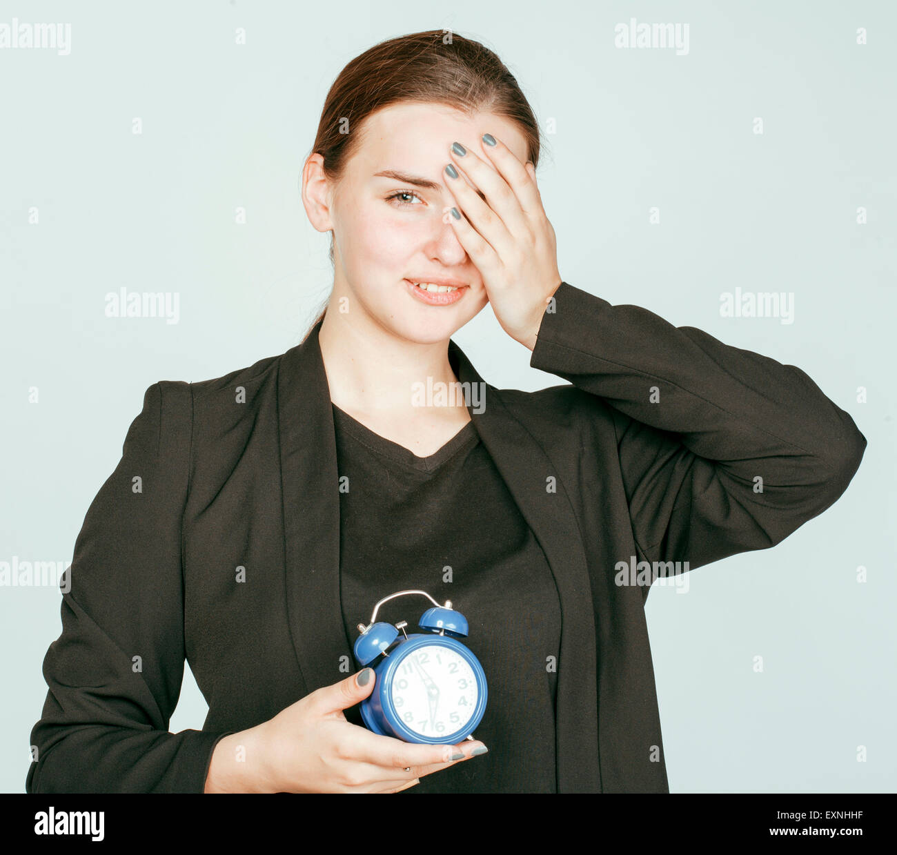 young beauty woman in business style costume waking up for work early ...