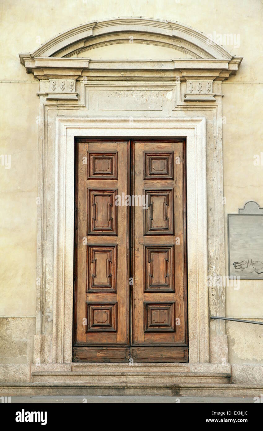 Wooden church door in Milan, Italy Stock Photo - Alamy