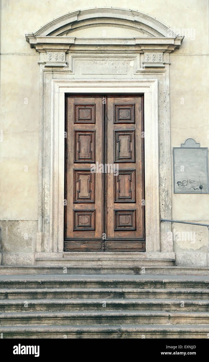 Wooden church door in Milan, Italy Stock Photo - Alamy