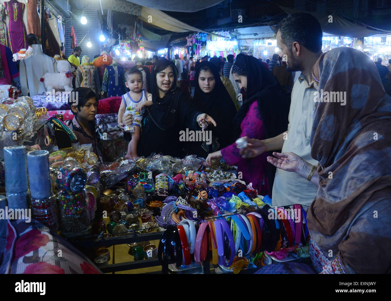 Lahore, Pakistan. 15th July, 2015. Pakistani Faithful Muslims women are ...