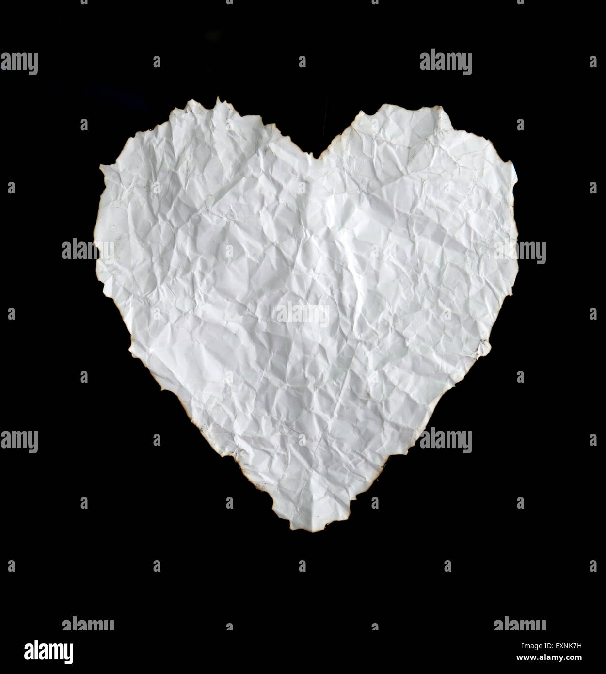 white crumpled heart shape paper on white background Stock Photo - Alamy