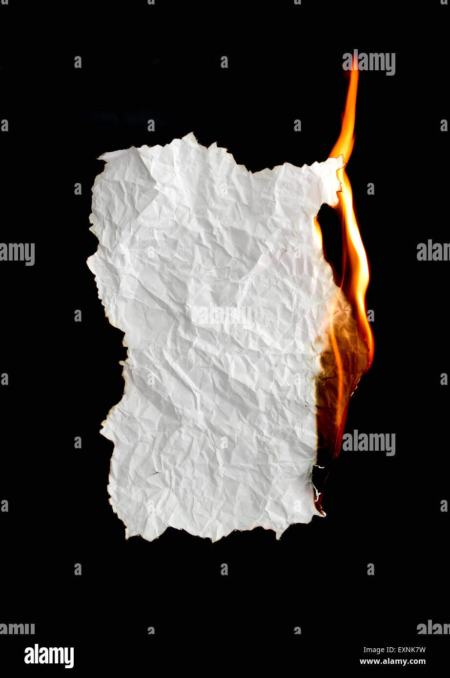 white crumpled paper burning on black background Stock Photo - Alamy