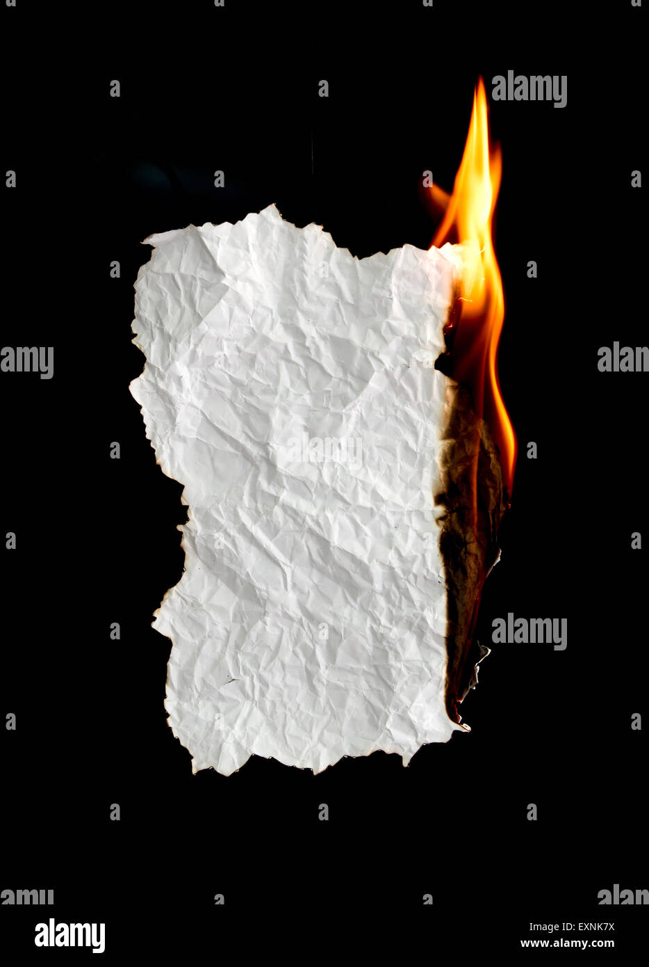 white crumpled paper burning on black background Stock Photo - Alamy