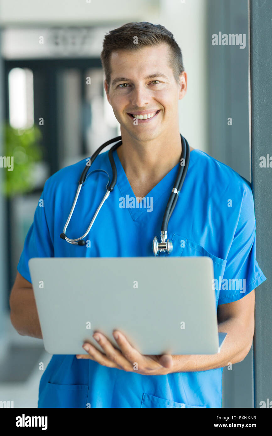 modern young male nurse using laptop Stock Photo - Alamy