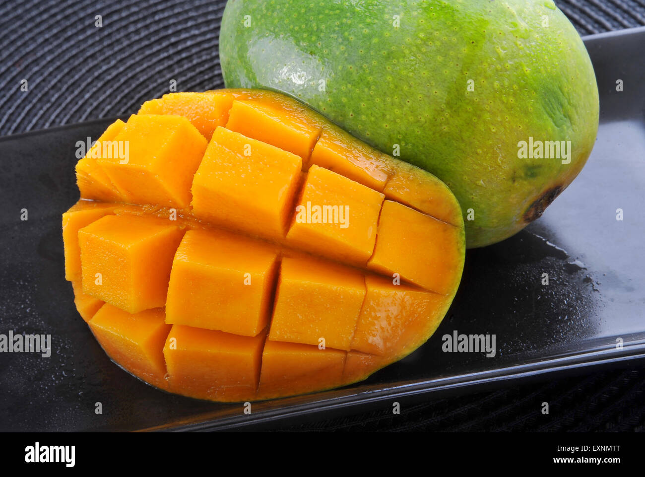 Mango in Black Dish Stock Photo - Alamy