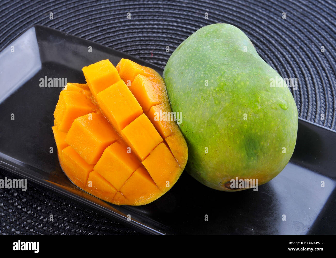 Mango in Black Dish Stock Photo - Alamy