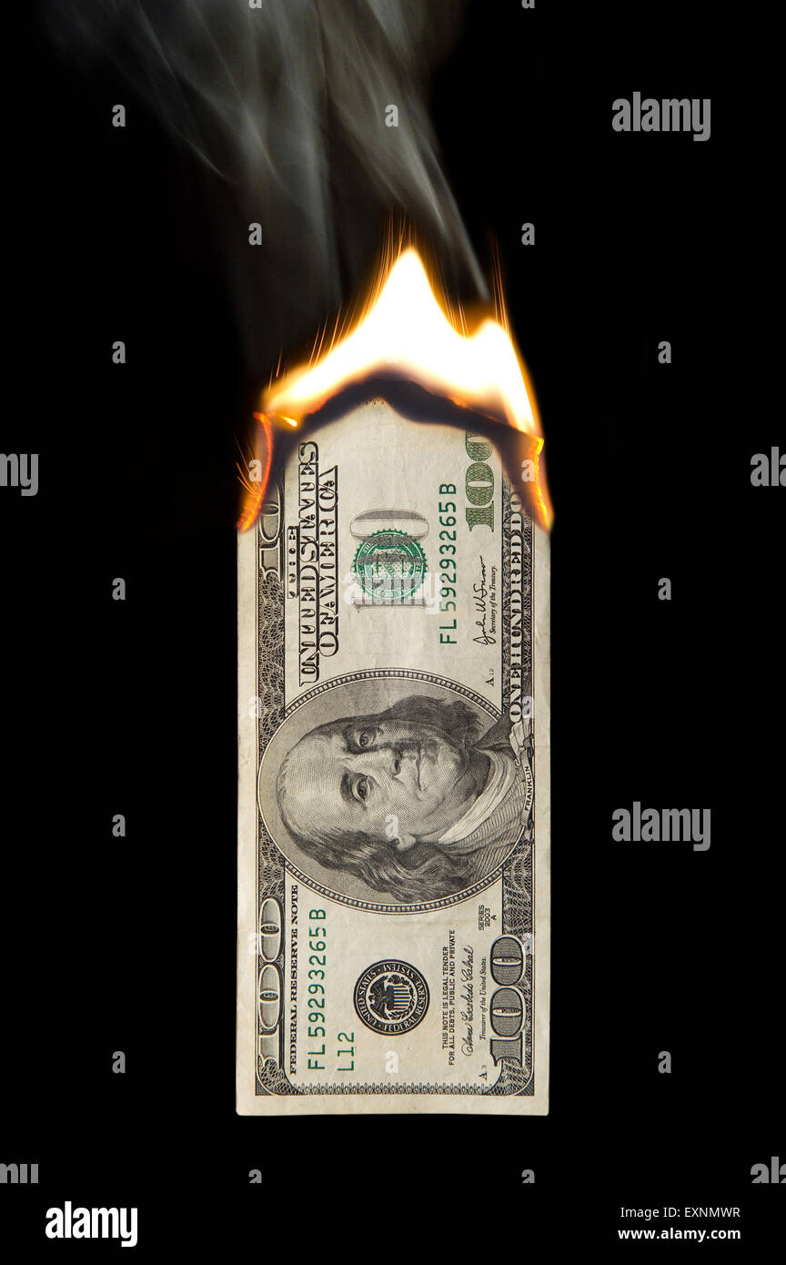 US 100 dollar bill on fire Stock Photo - Alamy