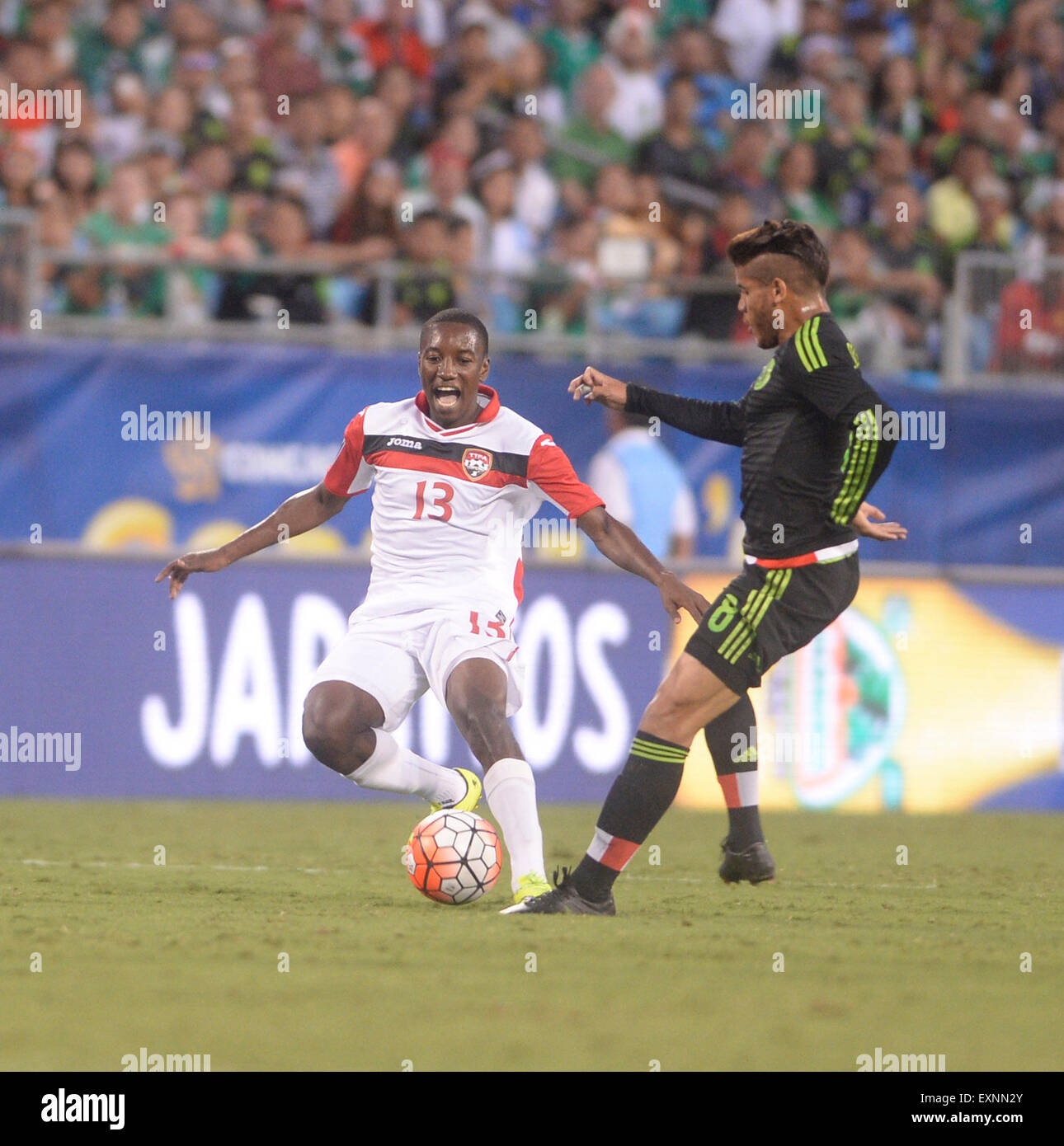 July 15, 2015:Trinidad midfielder Cordell Cato (13) dribbles past ...