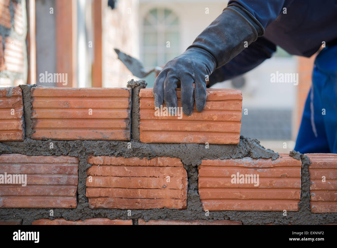 Bricklayer laying bricks construction house hi-res stock photography ...