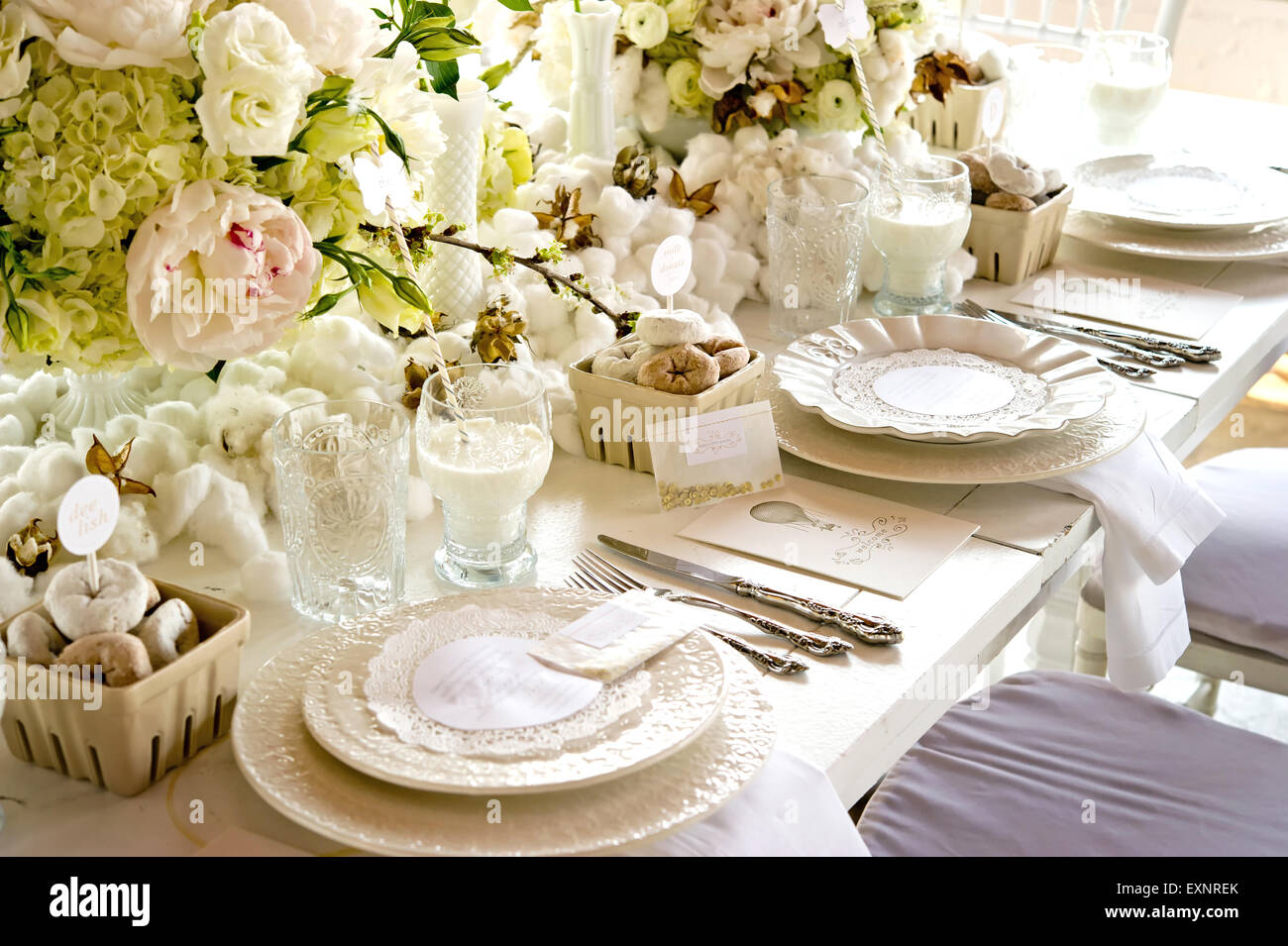 Image of a unique white wedding banquet table with place settings Stock ...