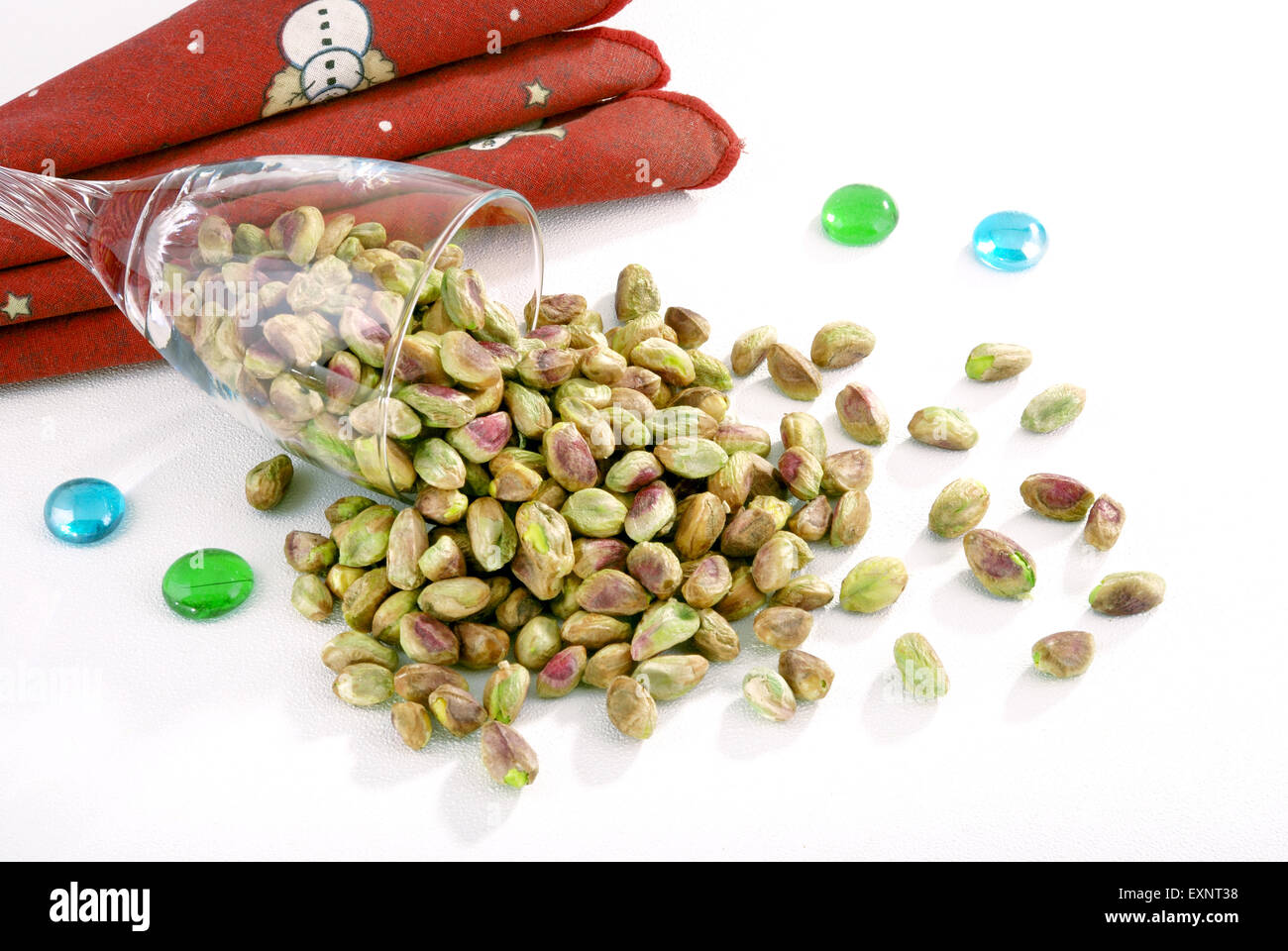 Pistachio falling from Glass Stock Photo - Alamy