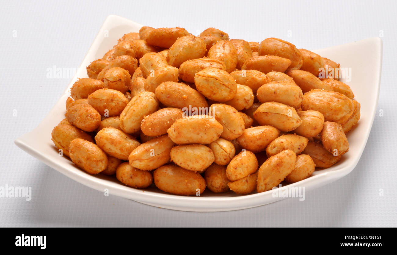 Spicy Peanuts in white dish Stock Photo - Alamy