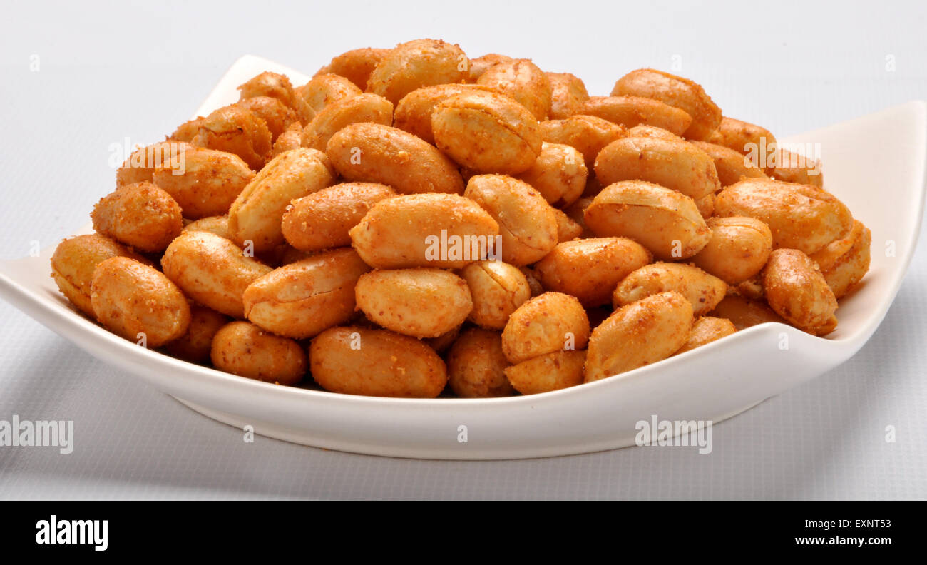 Spicy Peanuts in white dish Stock Photo - Alamy