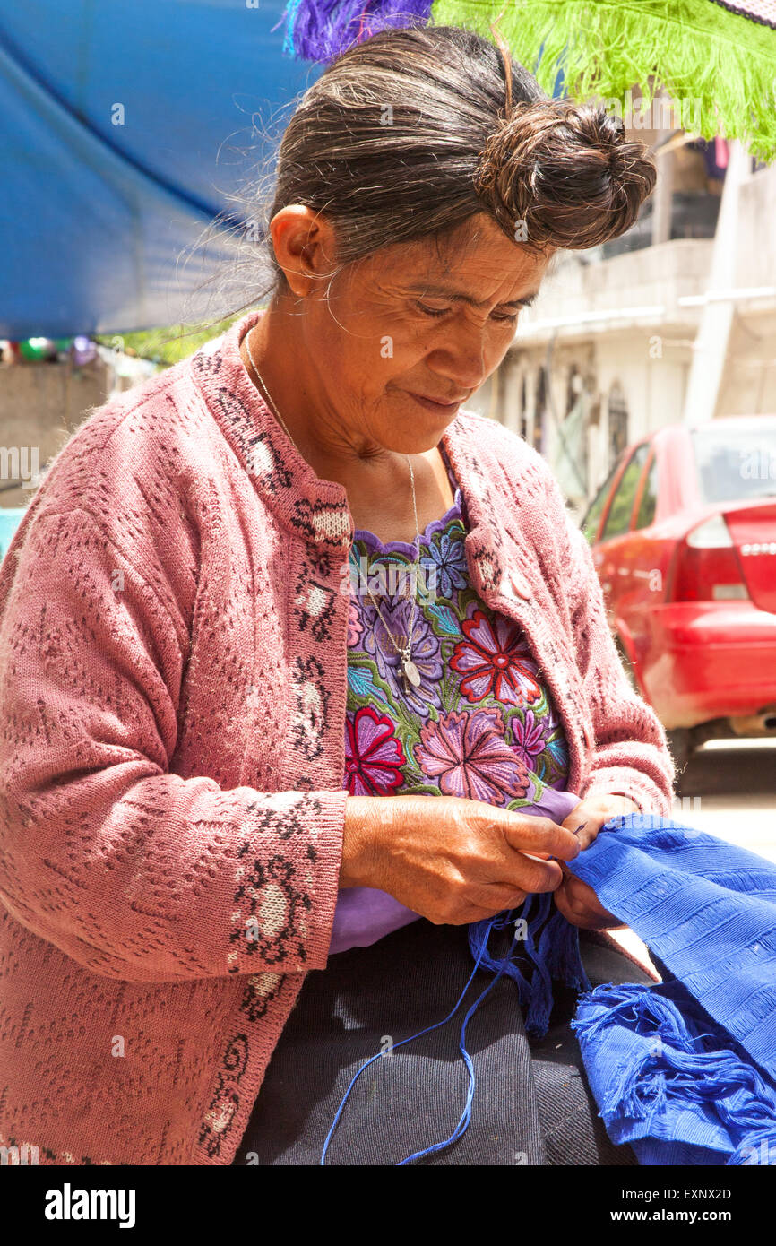 A traditional Tzotzil woman sews clothes and cloths Stock Photo - Alamy