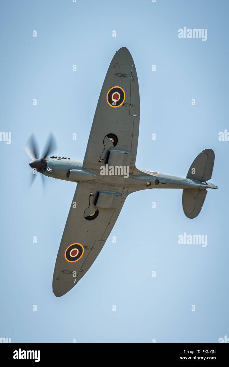 Single Spitfire flying against a blue sky, iconic image of the Battle ...