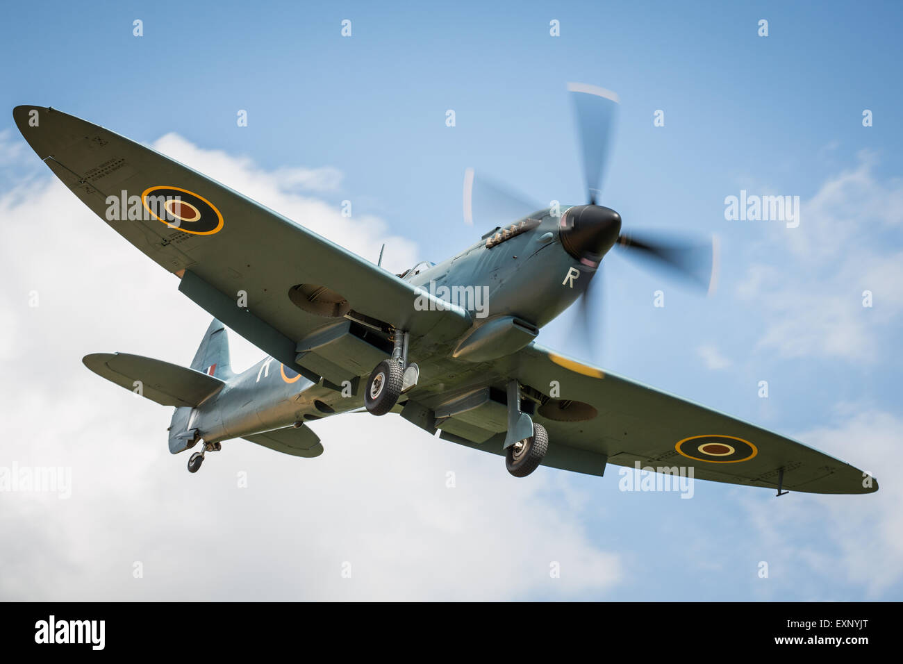 Single Spitfire flying against a blue sky, iconic image of the Battle ...