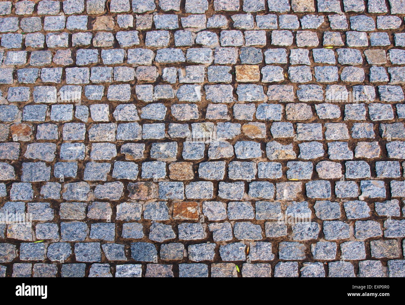 Old road pavement of the small rough granite tiles Stock Photo - Alamy