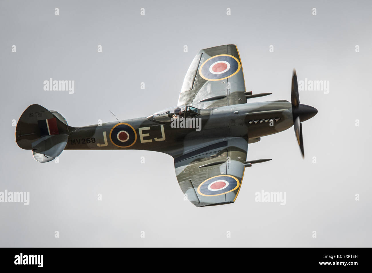 Single Spitfire flying against a blue sky, iconic image of the Battle ...