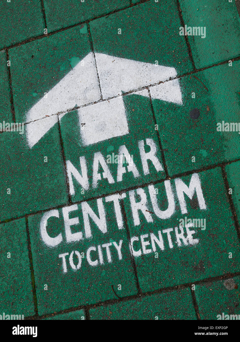 temporary to city centre sign painted on street sidewalk pavement ...