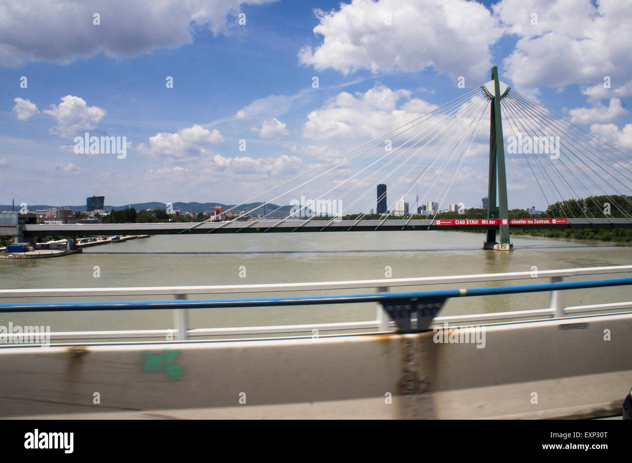 Danube River, bridge, writing billboard CIAO STAU Mit der schneller ins ...