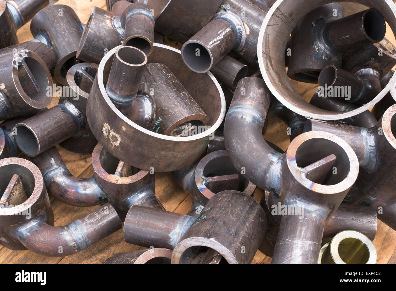Assorted pieces of steel tube at an industrial workshop Stock Photo - Alamy