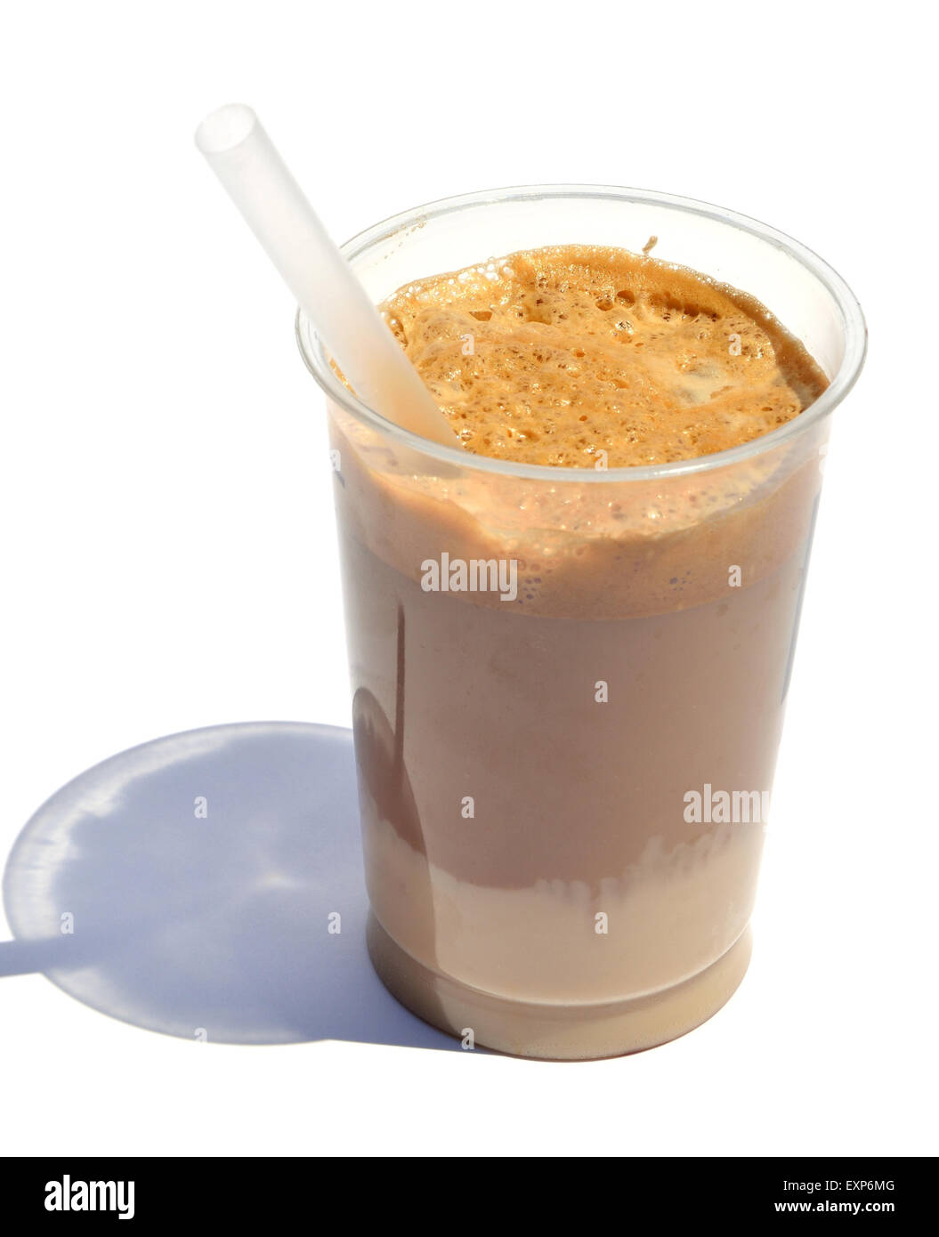 Glass of coffee frappe with rich foam and a straw Stock Photo - Alamy