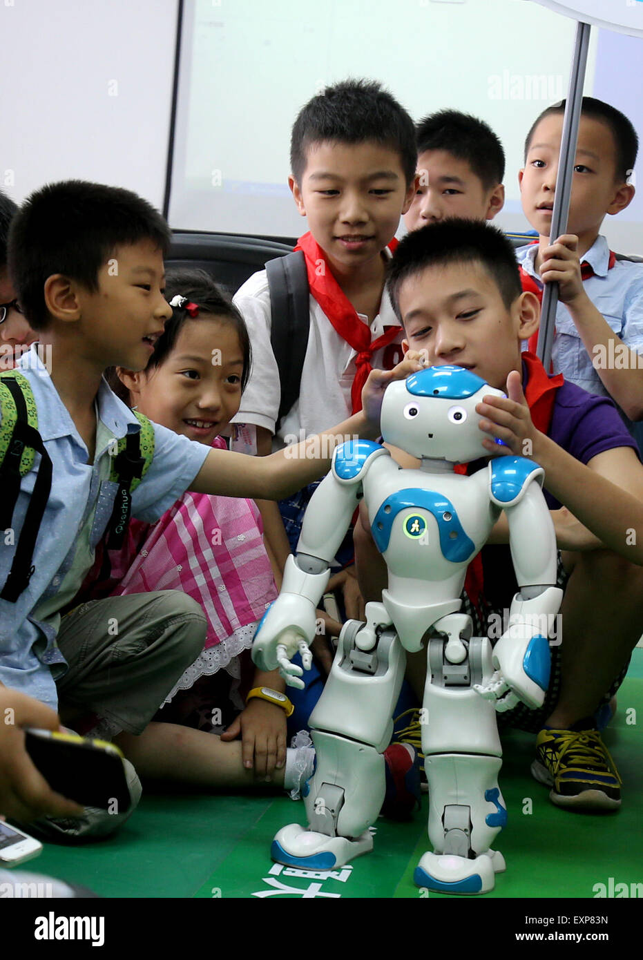 Shanghai, China. 16th July, 2015. Children interested in scientific ...