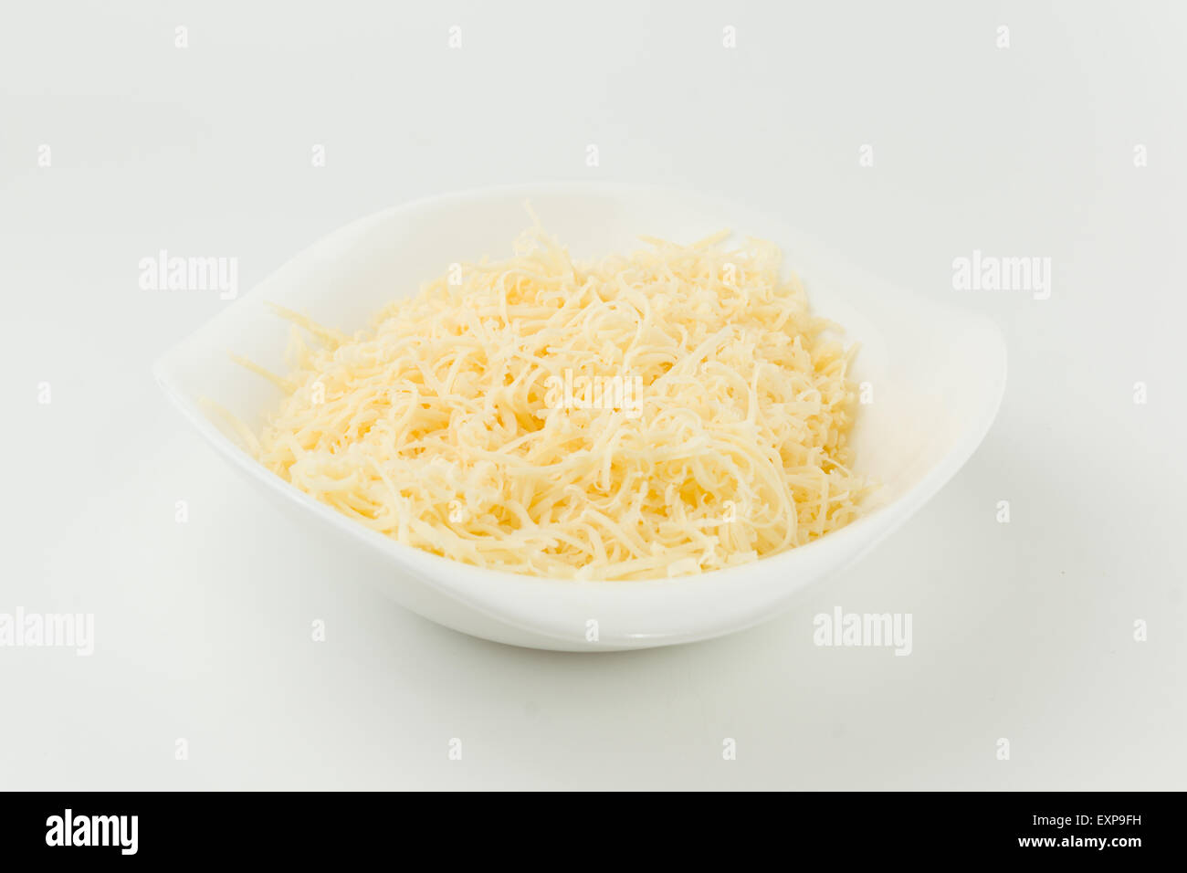 small grated cheese lies in a plate and is ready to use Stock Photo - Alamy