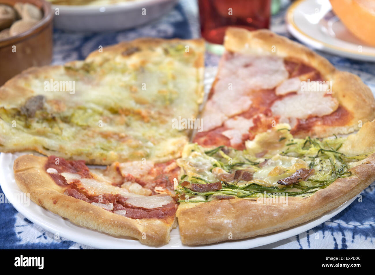 real Italian artisan pizza with four wedges of handmade pizza Stock ...
