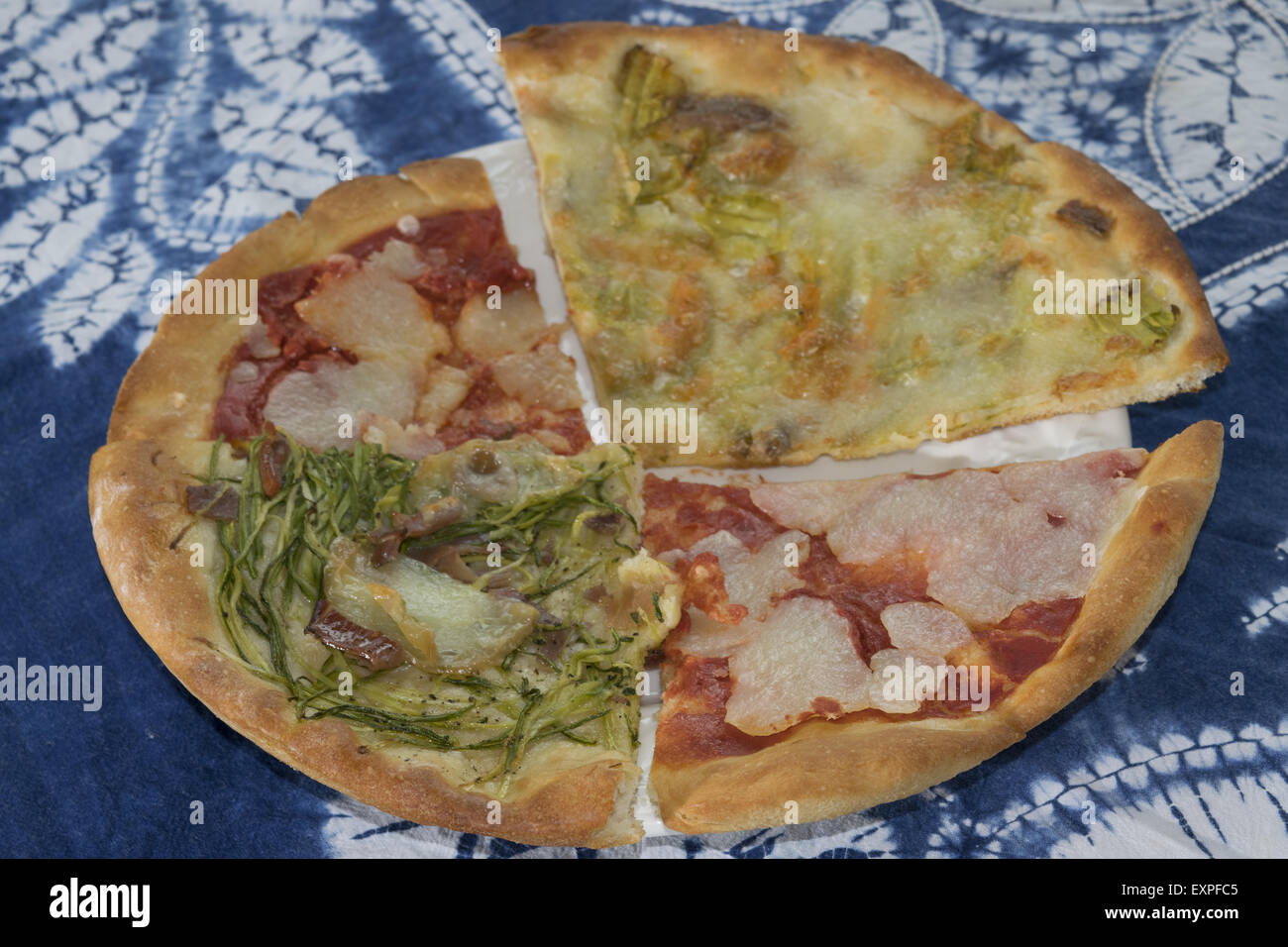 real Italian artisan pizza with four wedges of handmade pizza Stock ...