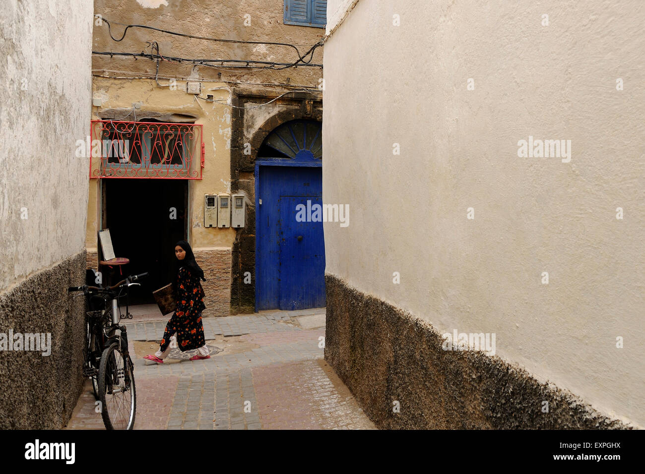 Girl walking in medina of Essaouira Stock Photo - Alamy