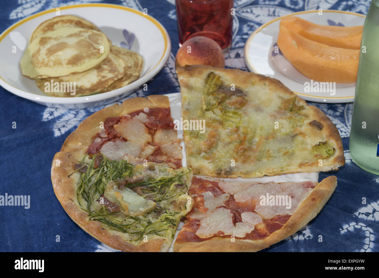 pizza with four wedges of handmade pizza Stock Photo - Alamy