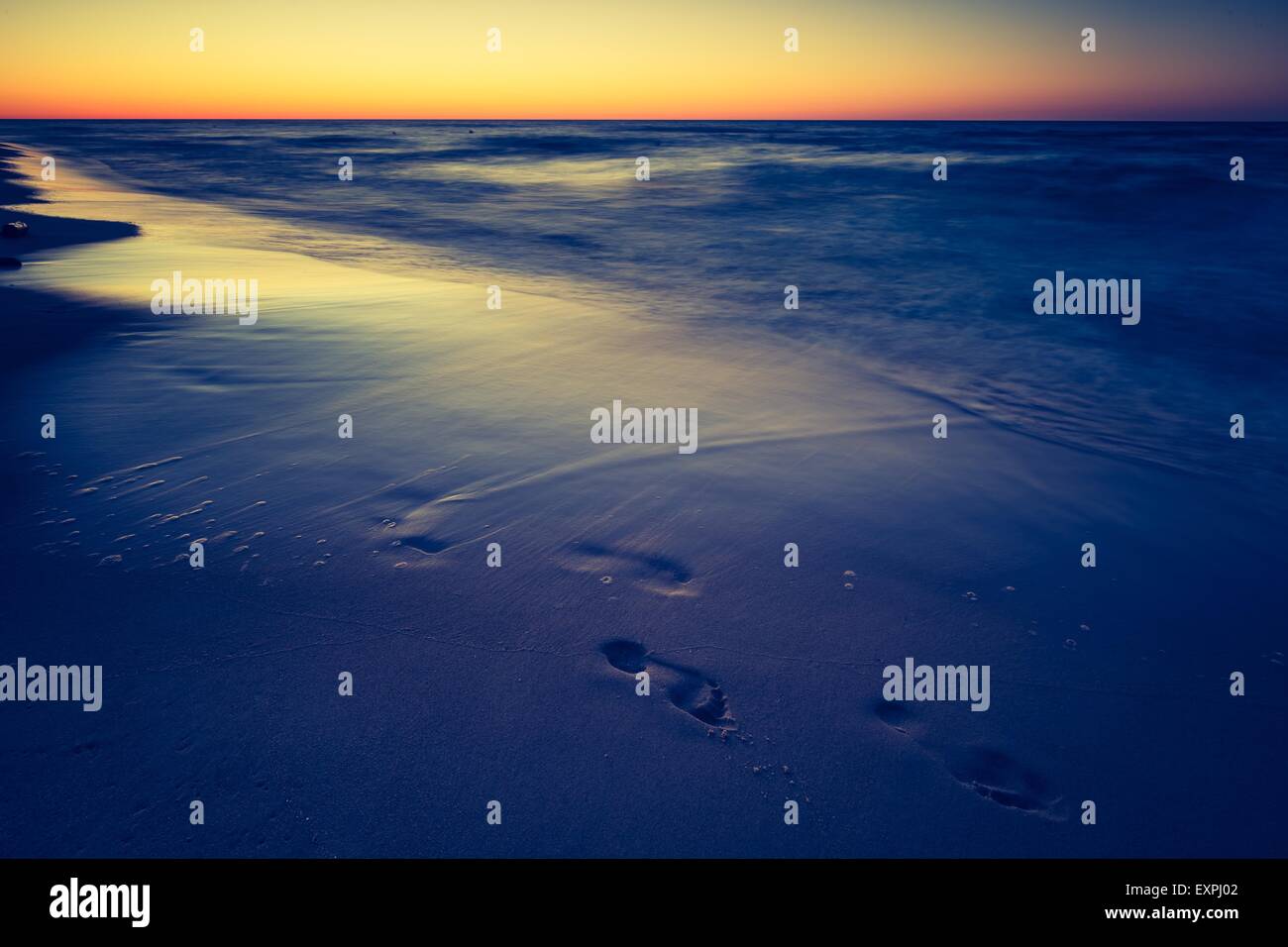 Vintage photo of beautiful after sunset landscape of Baltic Sea shore ...