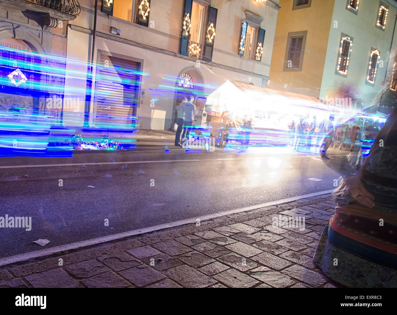 Blurry vision of luminara of Pisa at night Stock Photo - Alamy