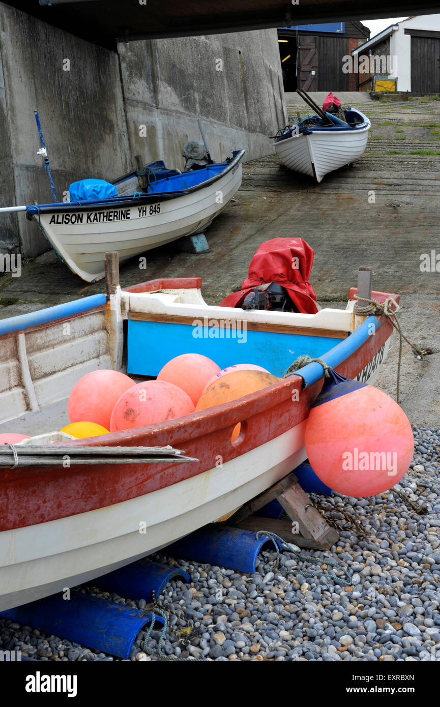 Crab fishing boats on the beach and West Cliff slipway at Sheringham on ...