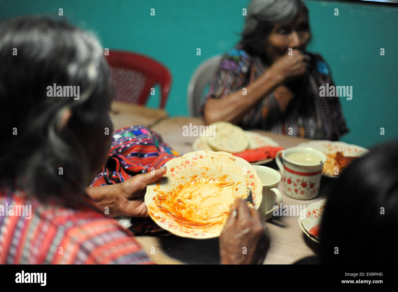 Guatemala indigenous women at lunch table provided by local NPO in San ...