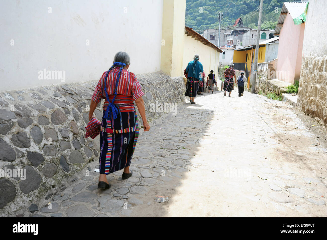 Guatemala indigenous women in traditional clothing walk in San Jorge La ...