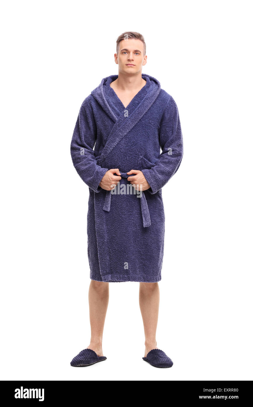 Full length portrait of a young man posing in a blue bathrobe isolated ...