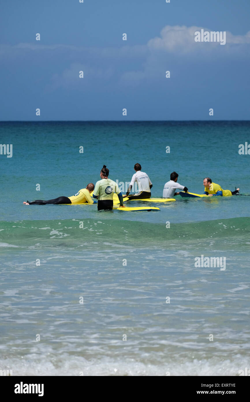 St Ives, Cornwall, UK: Group of people learning to Surf off Porthmeor ...