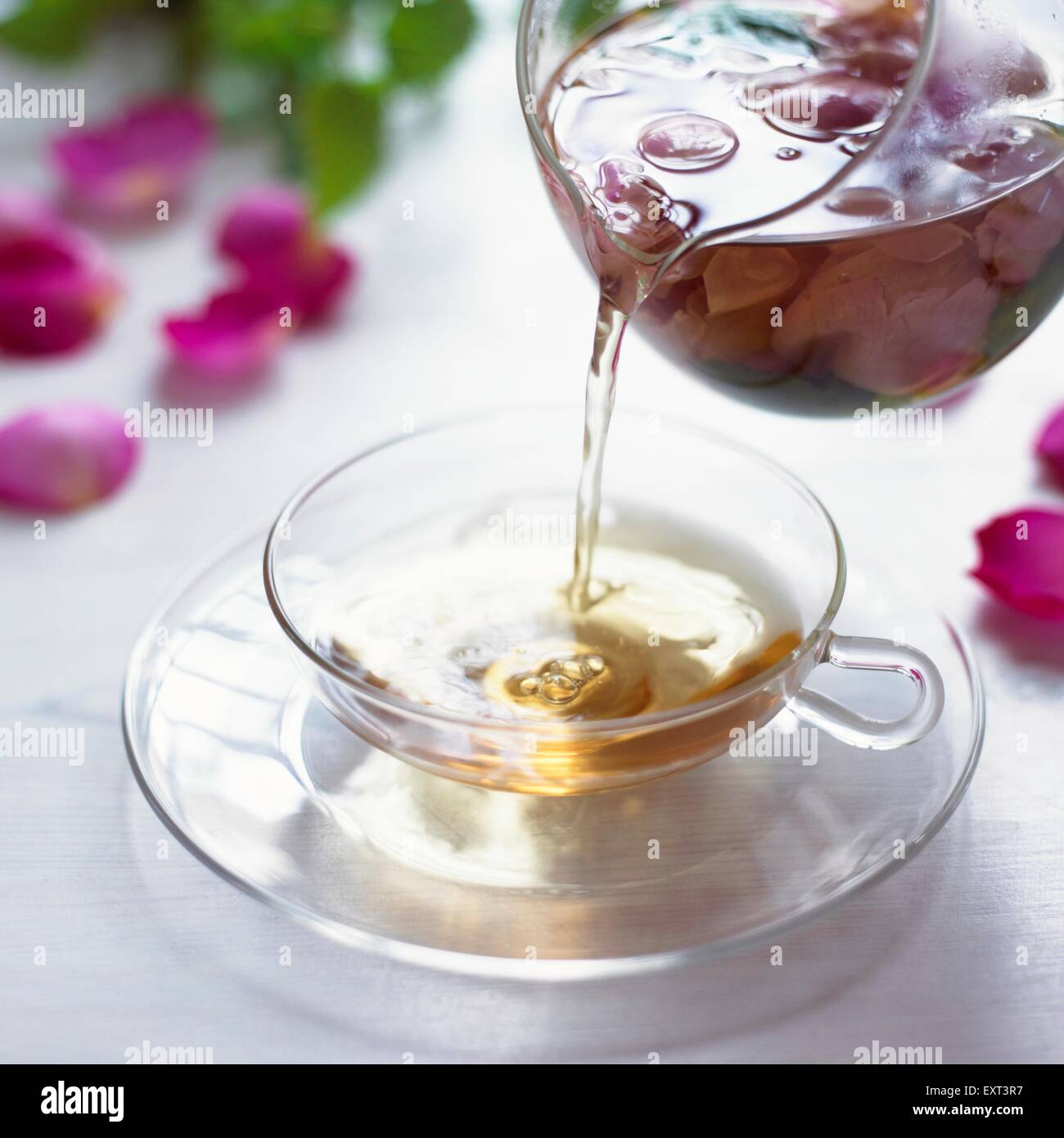 Pouring rose lemon tea into glass cup, close-up Stock Photo - Alamy
