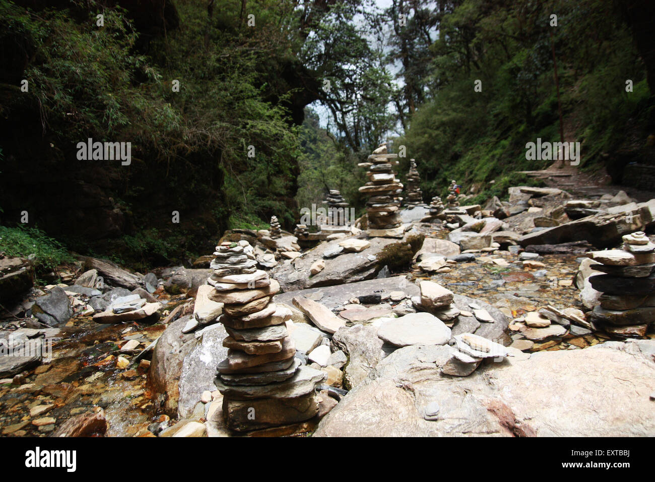 Rock balancing along a river in Nepal Stock Photo - Alamy