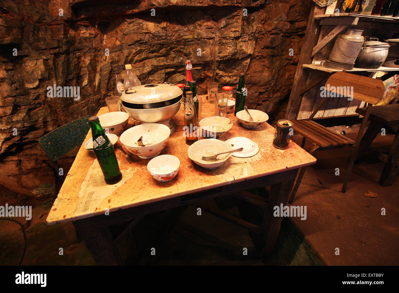 Ruined, abandoned chinese dining table Stock Photo - Alamy