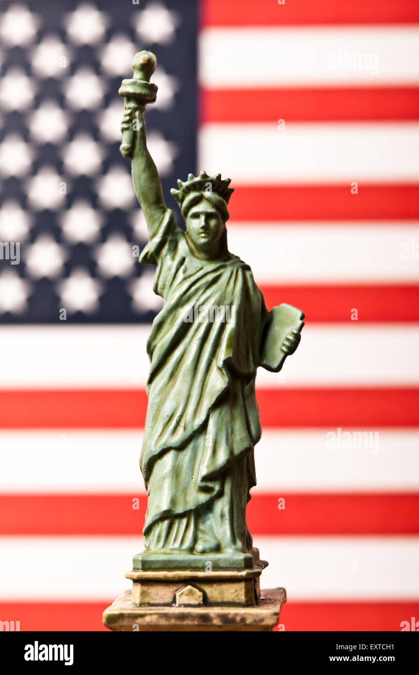 toy plastic miniature of Liberty statue and USA flag - 4th July ...