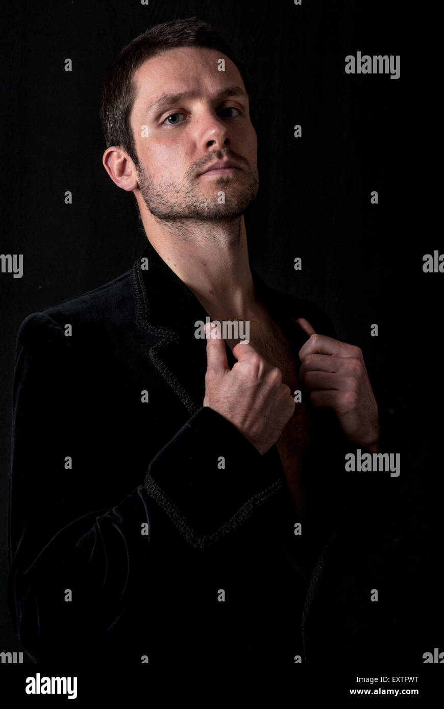 Low Key portrait of a male in black suit. Credit: Euan Cherry Stock ...