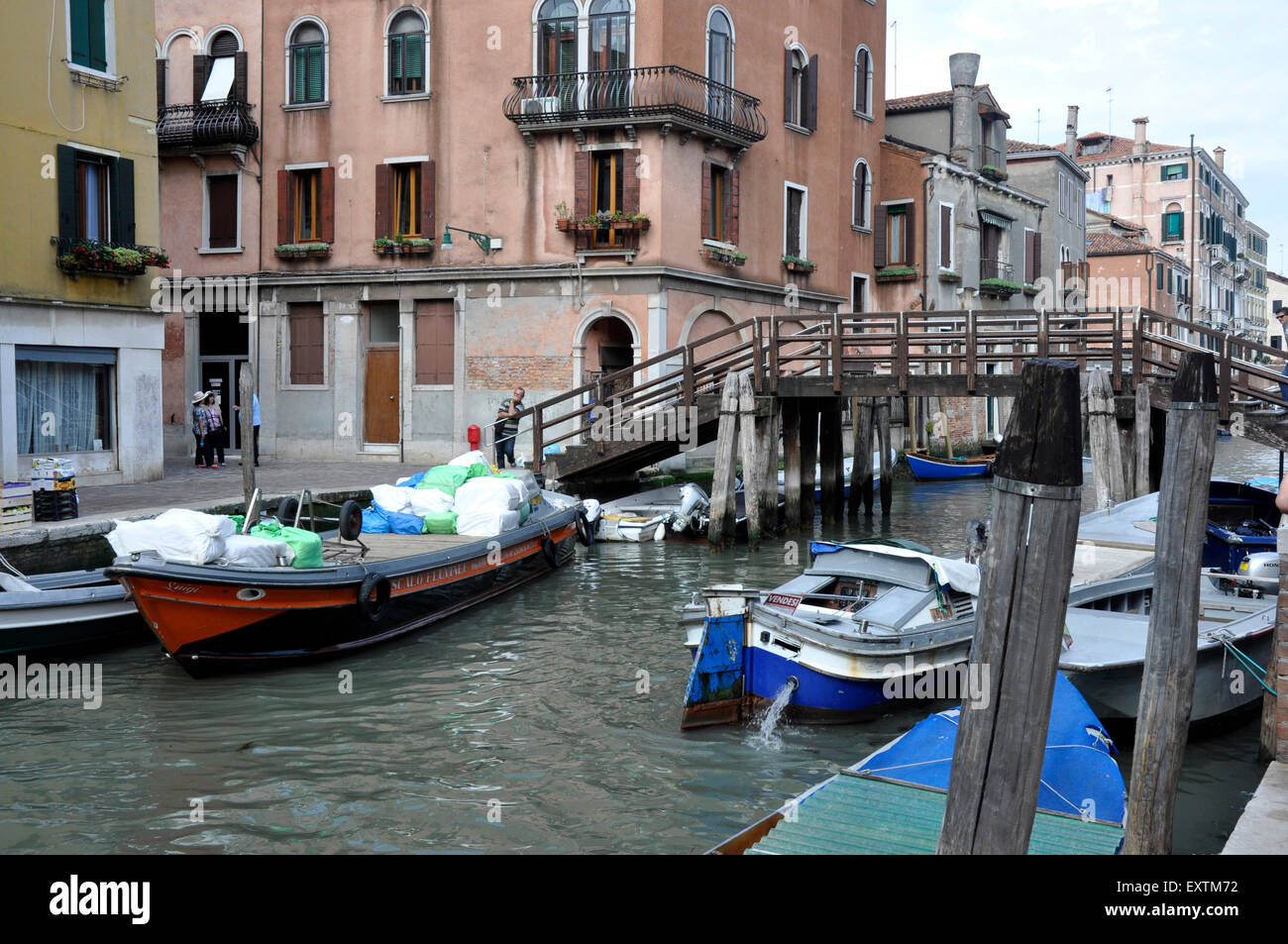 Italy Venice Cannaregio region - backwater canal scene - work boats ...