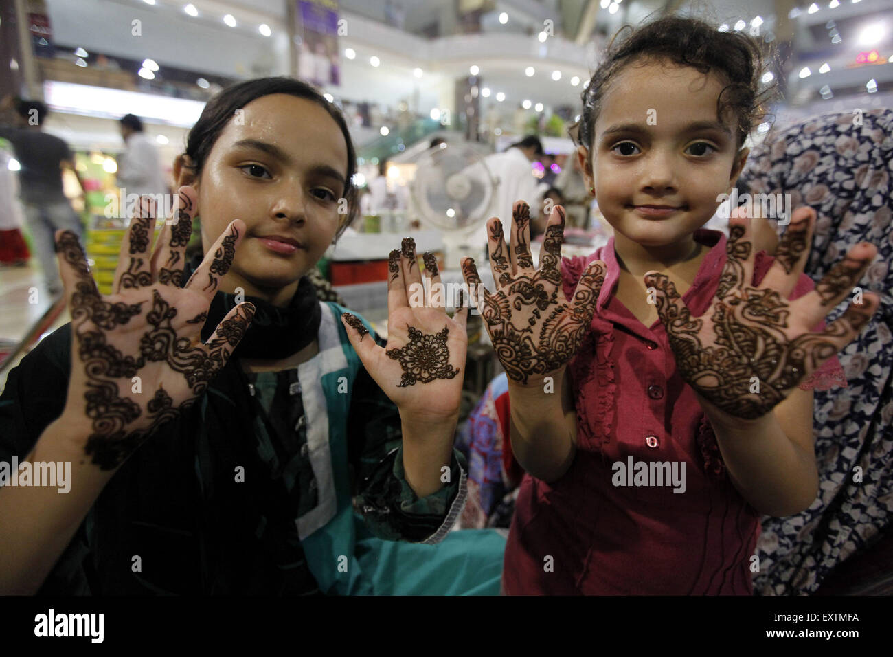 Peshawar. 16th July, 2015. Pakistani children show their hands painted ...